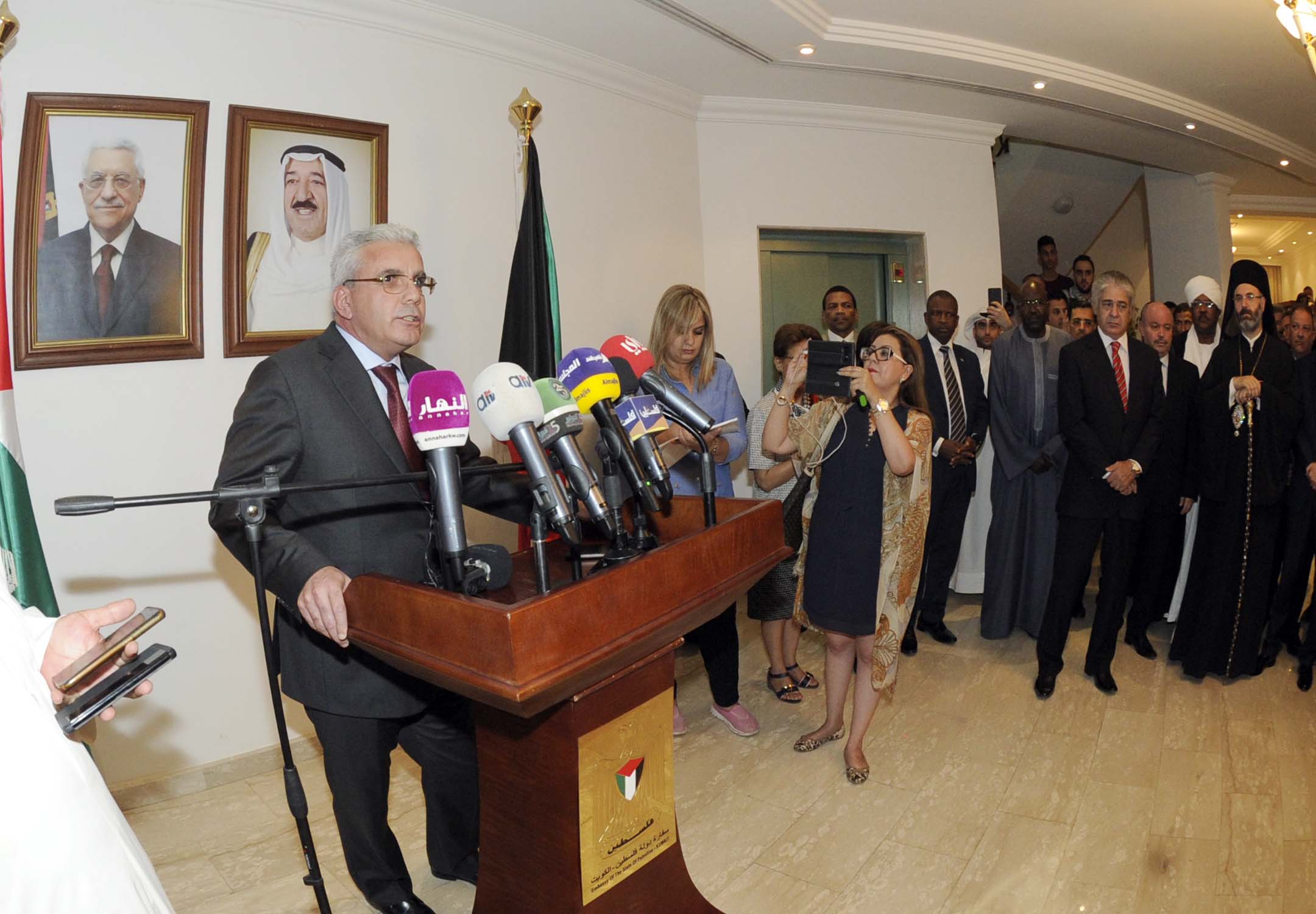 Palestinian Ambassador to Kuwait Rami Tahboub addresses the standing in ...